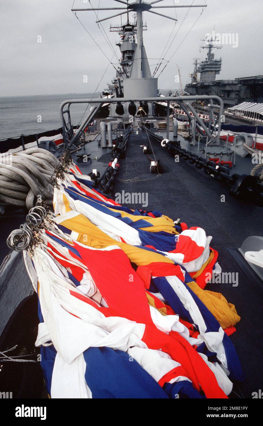 A flag hoist lies on the deck near the bow of the battleship USS IOWA ...
