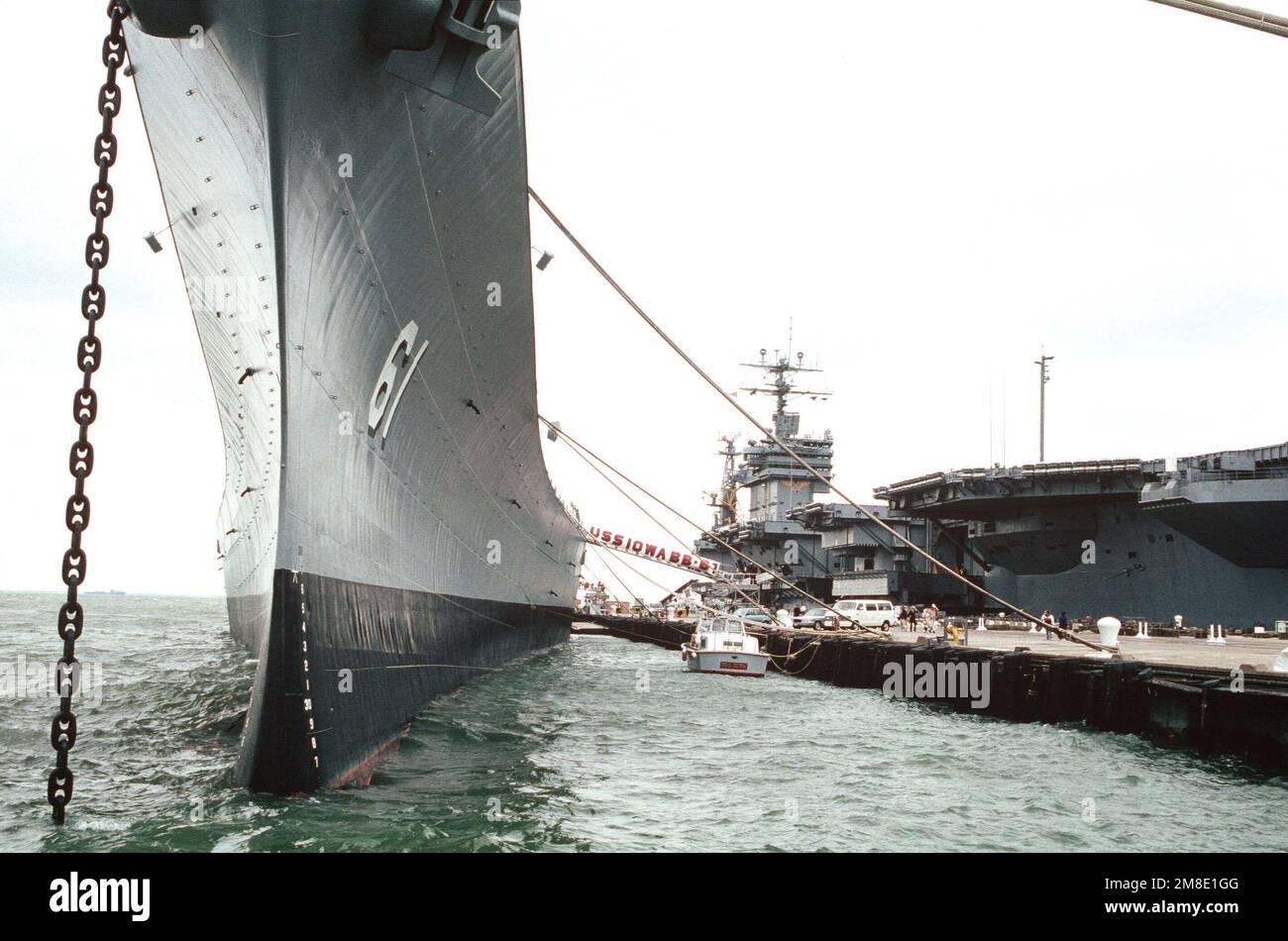 A close-up bow view of the battleship USS IOWA (BB 61) as it lies tied ...