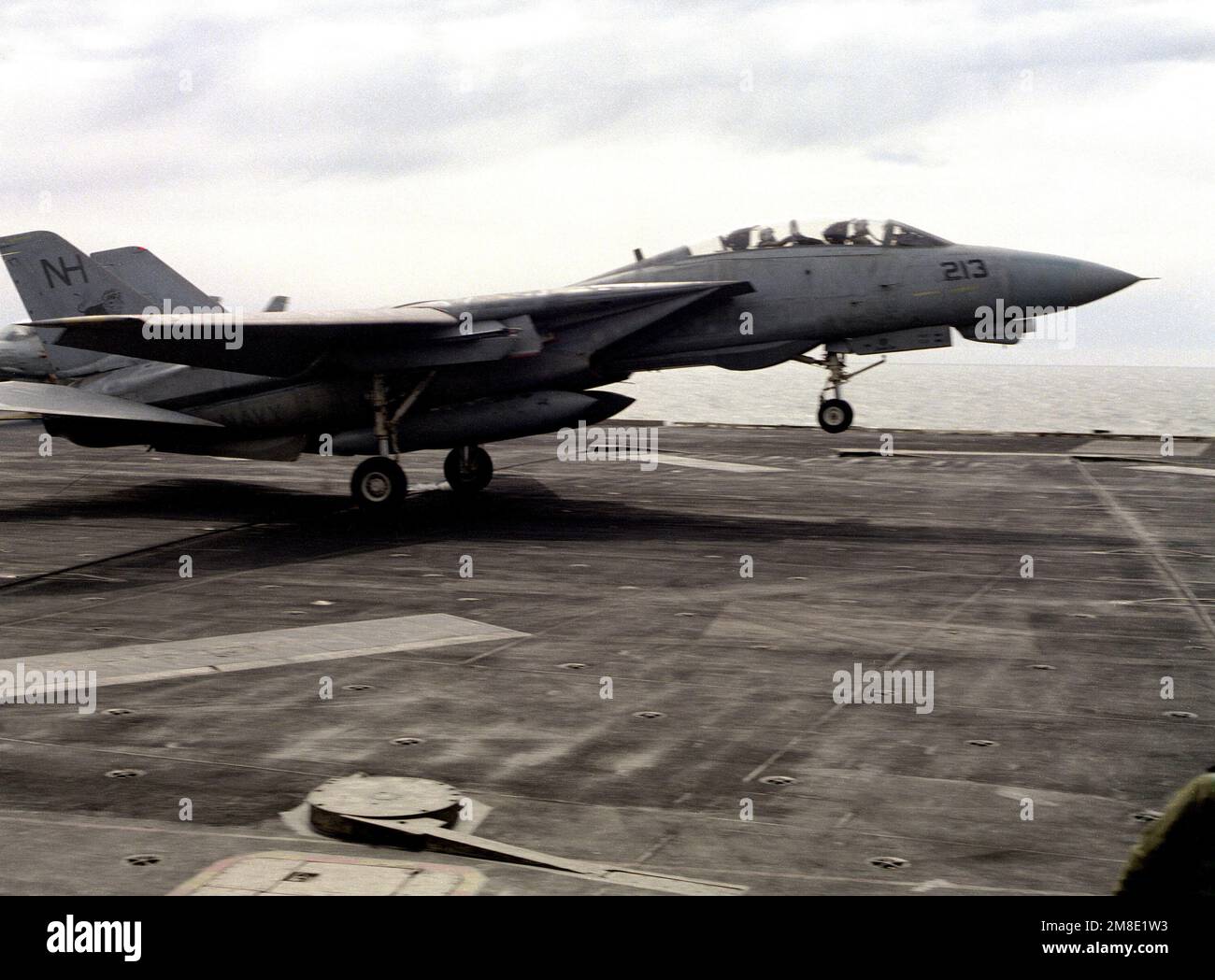 A Fighter Squadron 213 (VF-213)) F-14A Tomcat aircraft practices touch ...