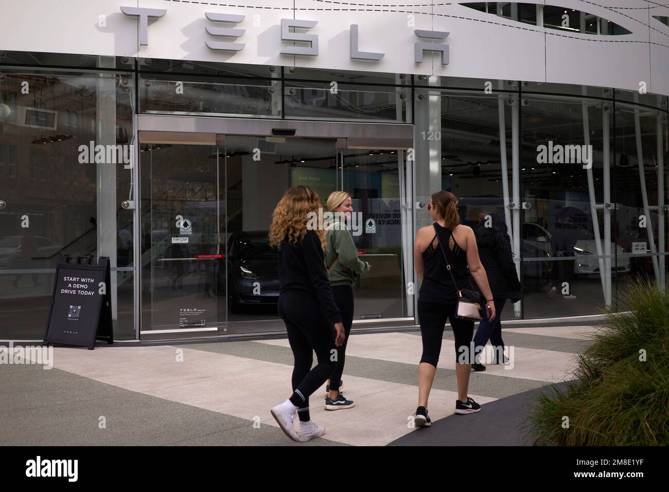 Los Angeles, California, USA. 13th Jan, 2023. People walk by a Tesla ...