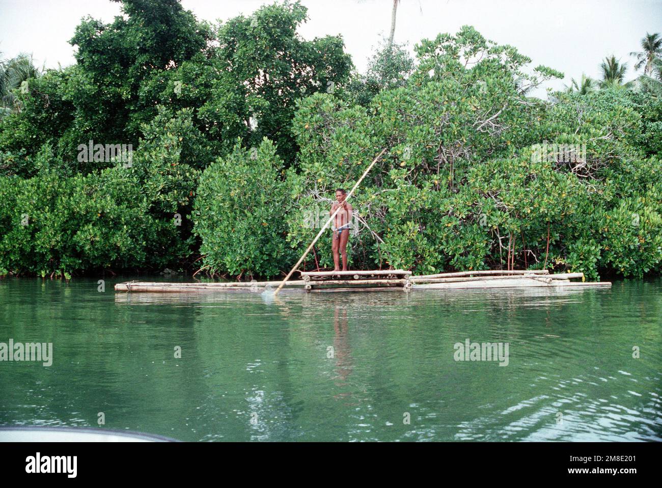 A Yapese villager fishes in a local river. Country: Micronesia Stock ...