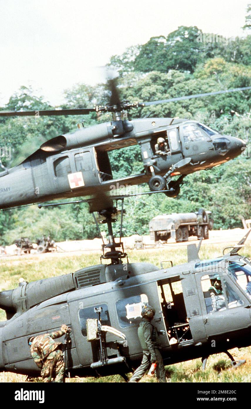 UH-60 Black Hawk (Blackhawk) helicopters stand by to evacuate wounded U ... UH-60 Black Hawk (Blackhawk) helicopters stand by to evacuate wounded U ...
