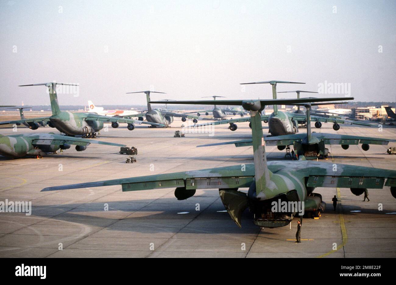 C-5 Galaxy aircraft and other aircraft on the ramp at the airbase ...