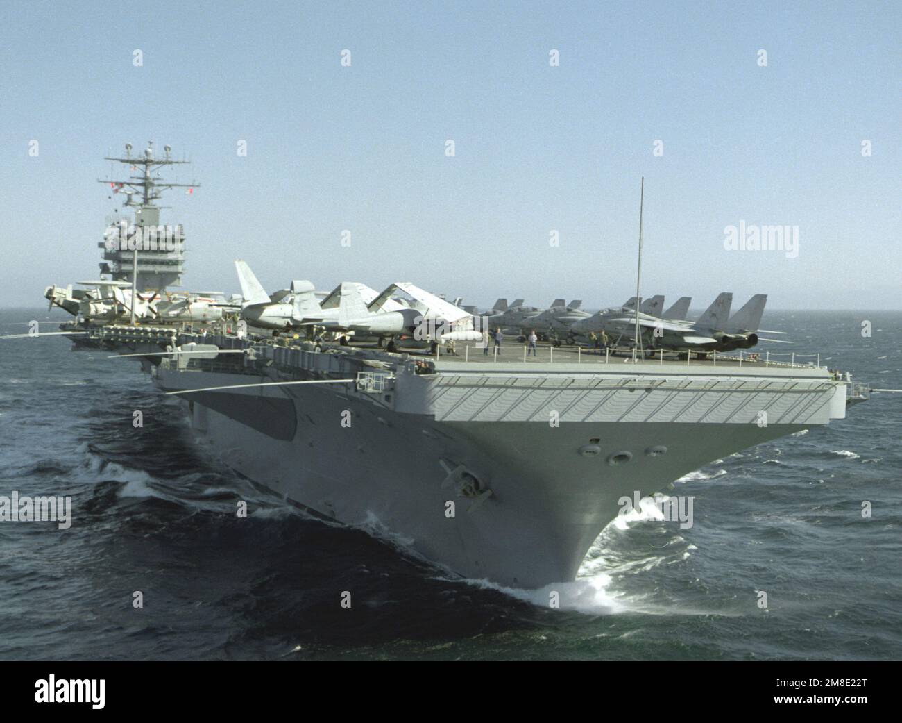 A starboard bow view of the nuclear-powered aircraft carrier ABRAHAM ...