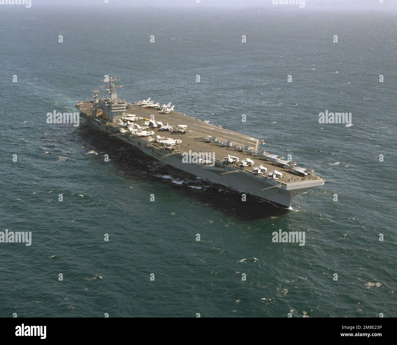 A starboard bow view of the nuclear-powered aircraft carrier ABRAHAM ...