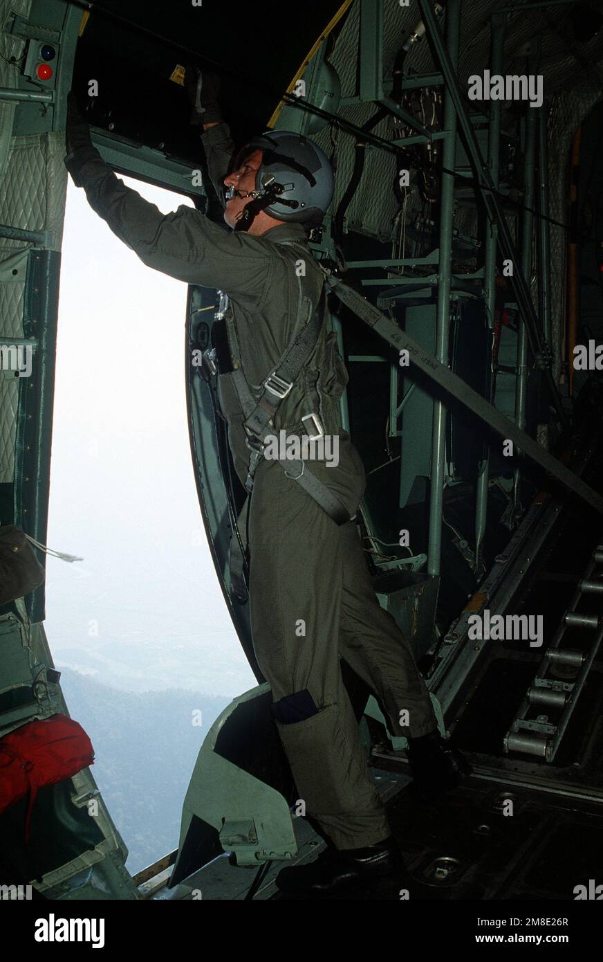 SRA Paul Stoner, the loadmaster aboard a 345th Tactical Airlift ...