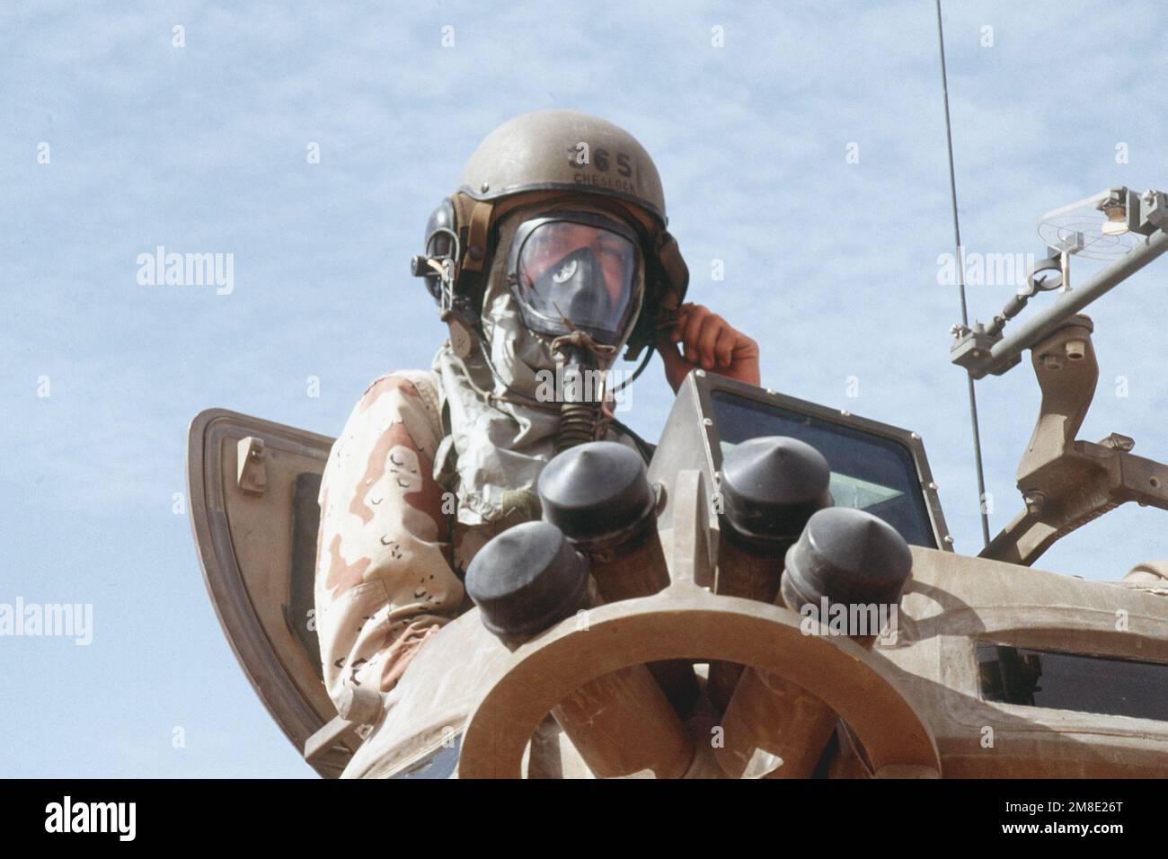 A Marine armored vehicle crewman wears a Nuclear-Biological-Chemical ...