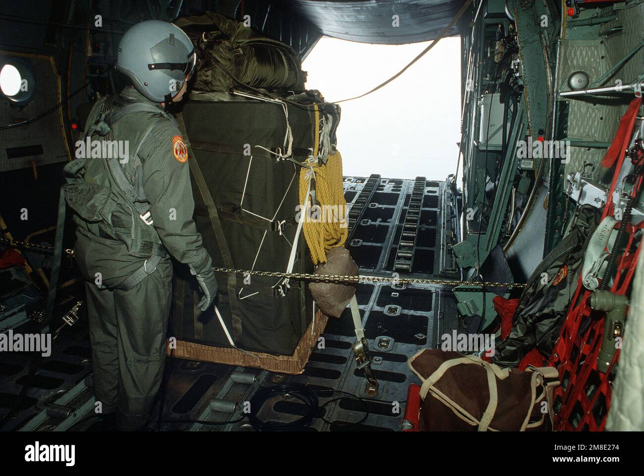 SMSGT Doug Moss, the loadmaster aboard a 21st Tactical Airlift Squadron ...