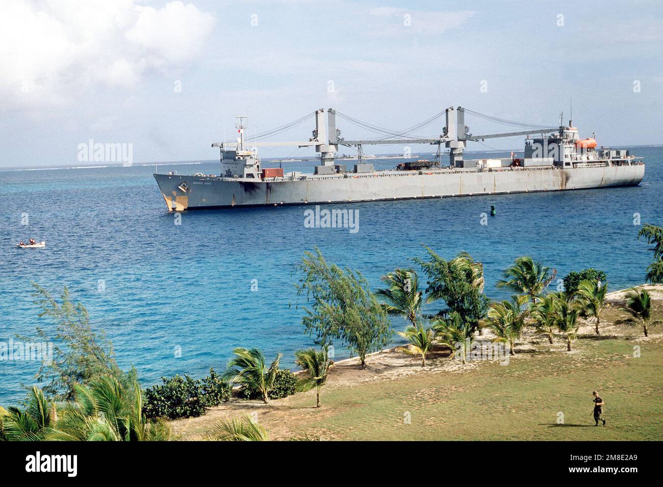 A port view of the Military Sealift Command auxiliary crane ship ...