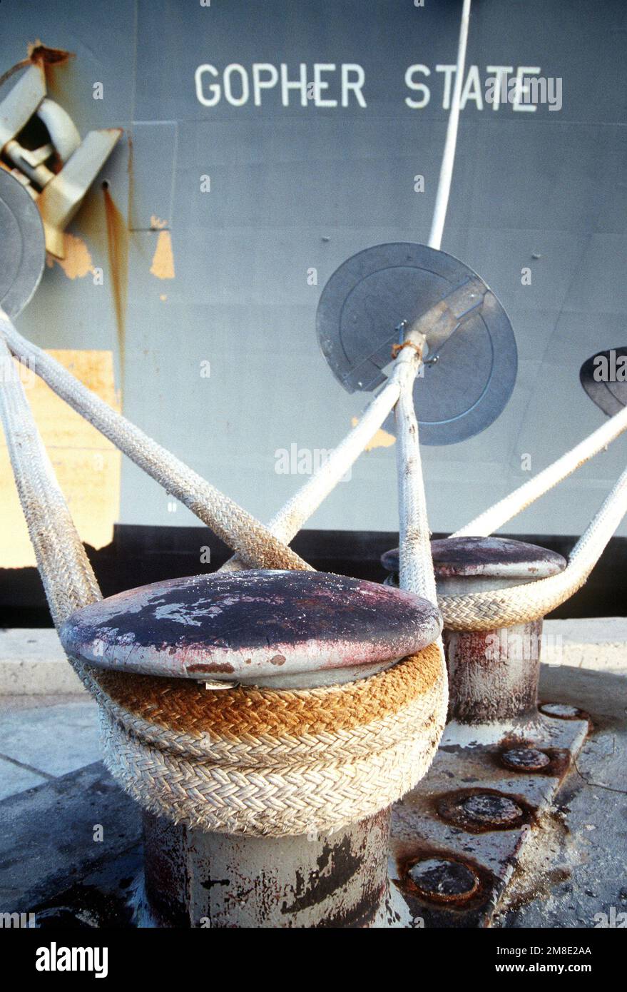 Mooring lines from the Military Sealift Command auxiliary crane ship ...