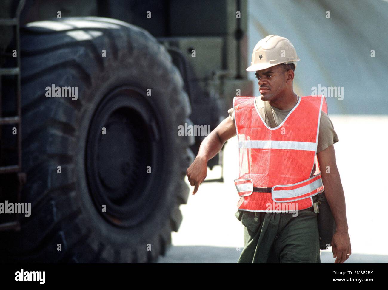 SPC Douglas Megginson of the 155th Transportation Company signals to ...