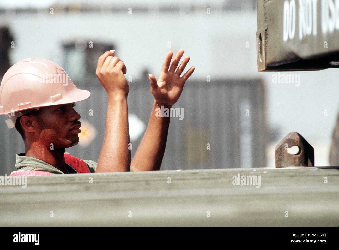 SPC Tracey Green of the 155th Transportation Company directs the driver ...