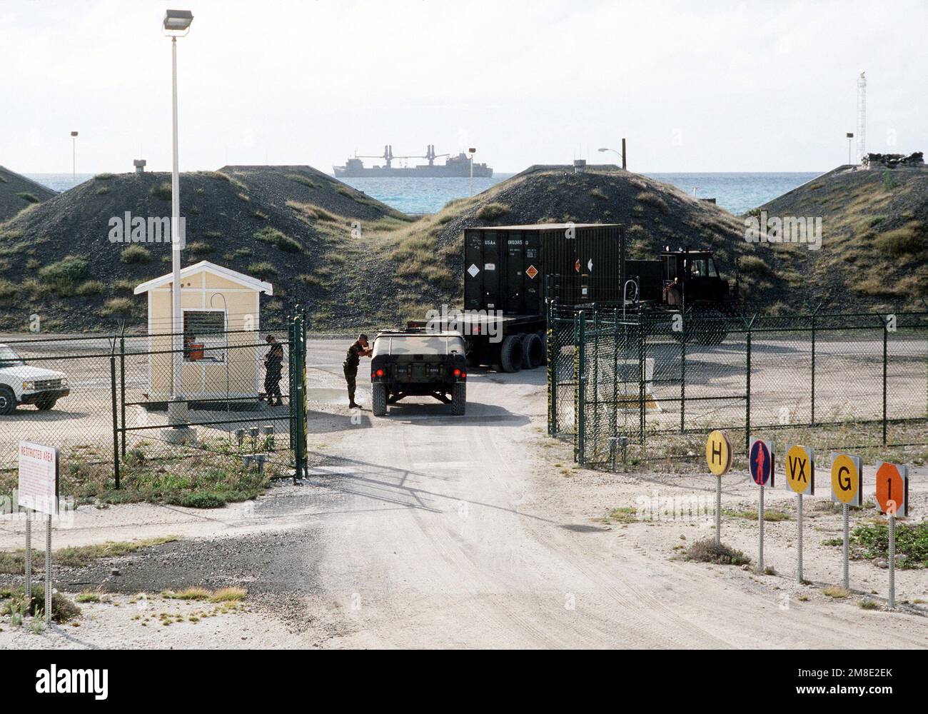 An M998 High-Mobility Multipurpose Wheeled Vehicle (HMMWV) follows an M ...