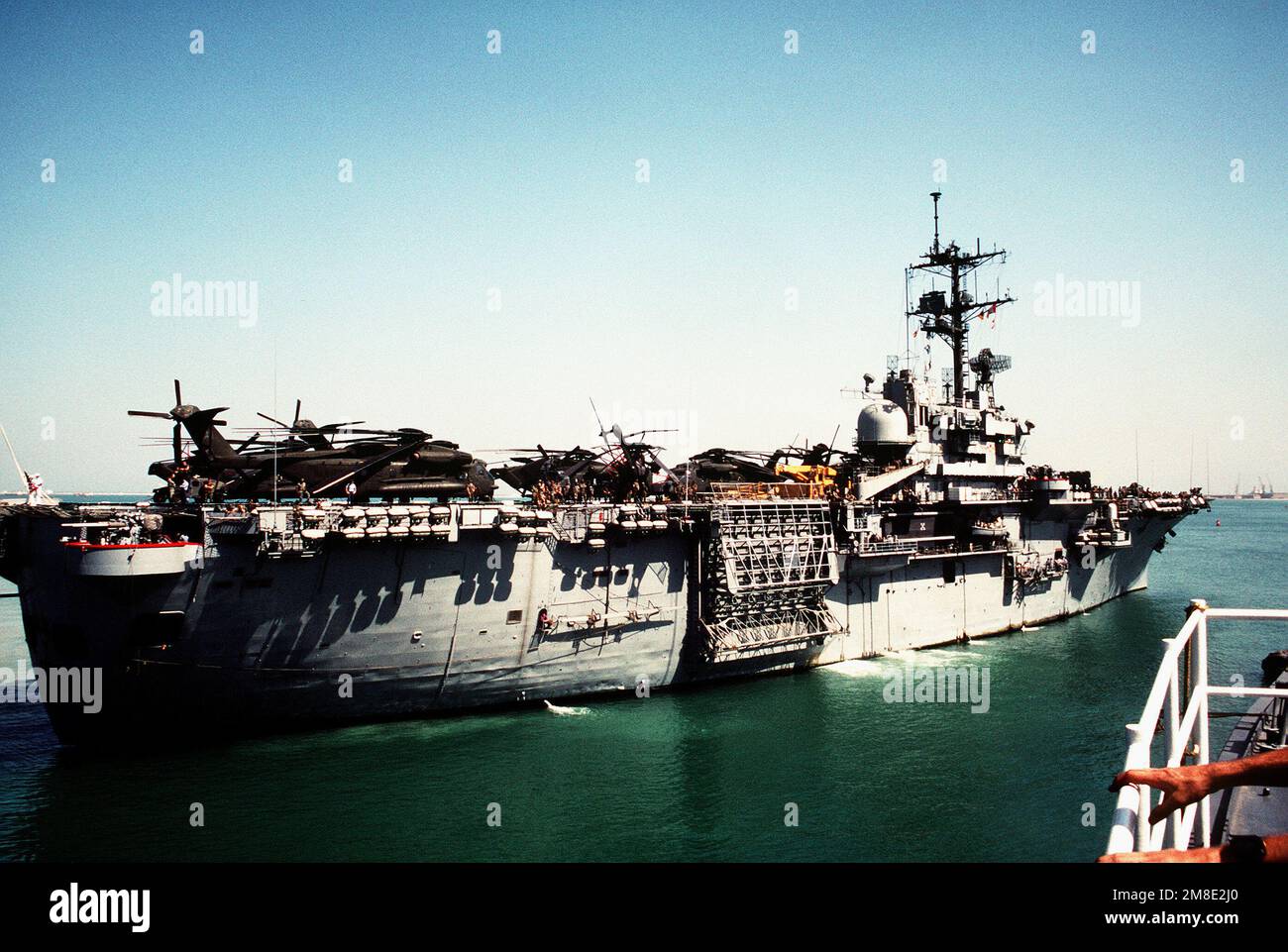 CH-53E Super Stallion helicopters line the deck of the amphibious ...