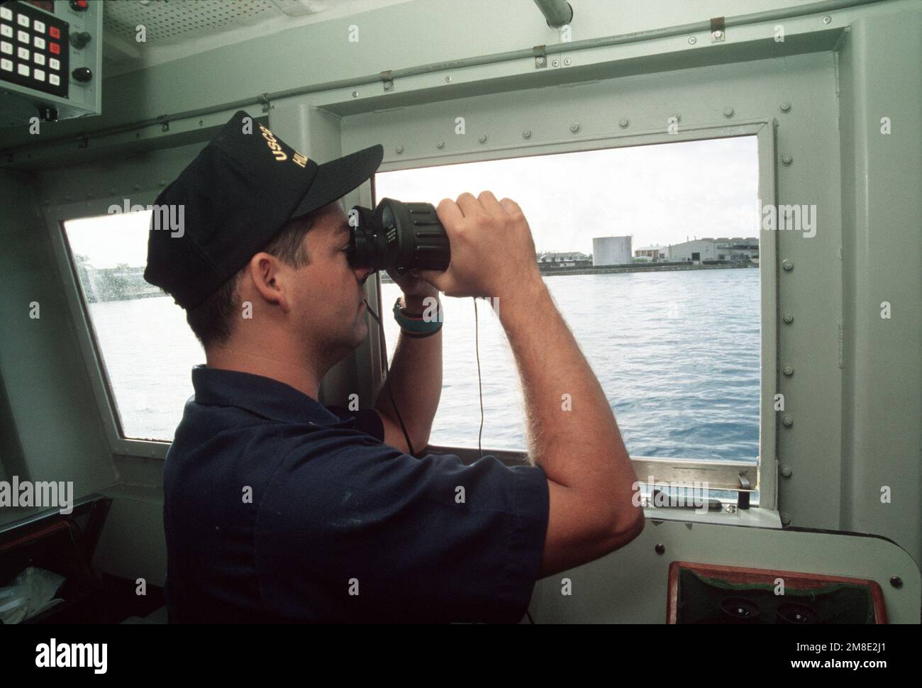 Quartermaster 2nd Class Patrick G. Allen scans the harbor from the ...