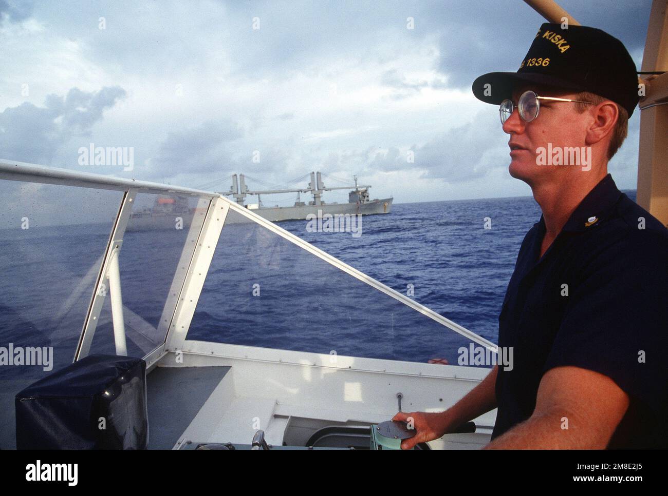 Quartermaster 1ST Class Kixon Meyer mans the navigator's station aboard ...