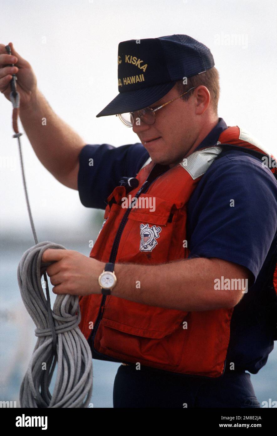 A crewmen stows a line aboard the Coast Guard large patrol craft USCGC ...
