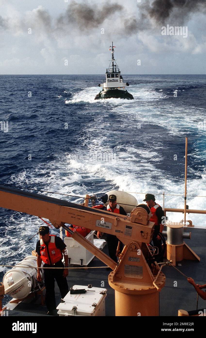 A commercial tug follows the Coast Guard large patrol craft USCGC KISKA ...