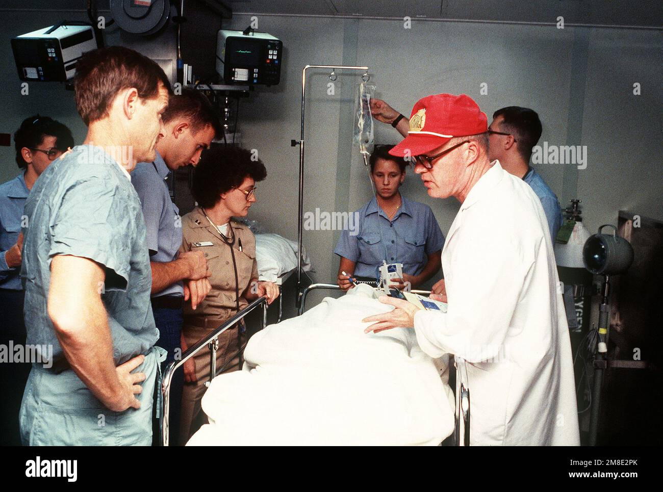CAPT Robert Abbe, left, a U.S. Navy doctor, consults with LT. COL ...