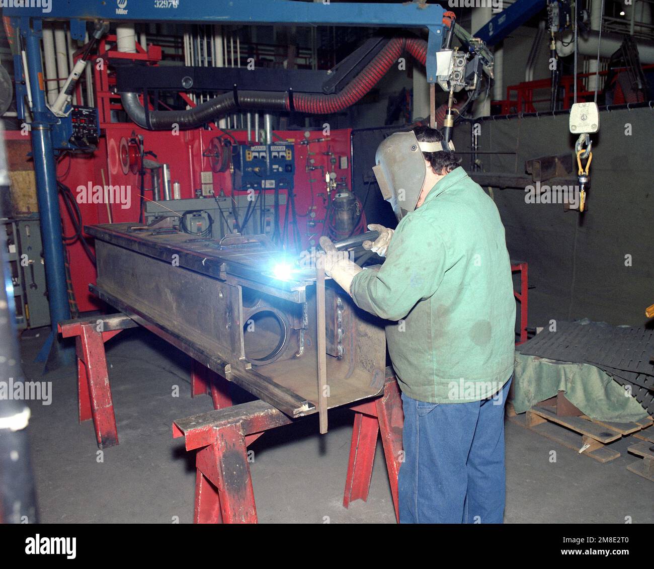 Leo Harvey, a civilian employee, welds a portion of the cradle for an M ...