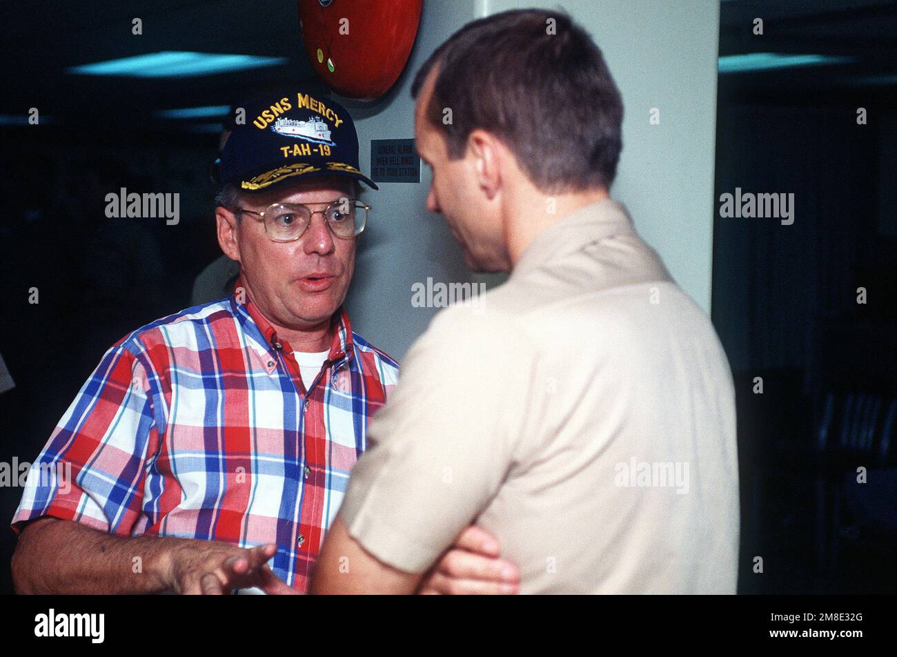 Secretary of the Navy H. Lawrence Garrett III talks with CAPT. Paul ...