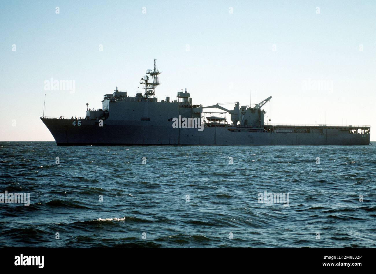 A port beam view of the dock landing ship TORTUGA (LSD 46) at anchor ...