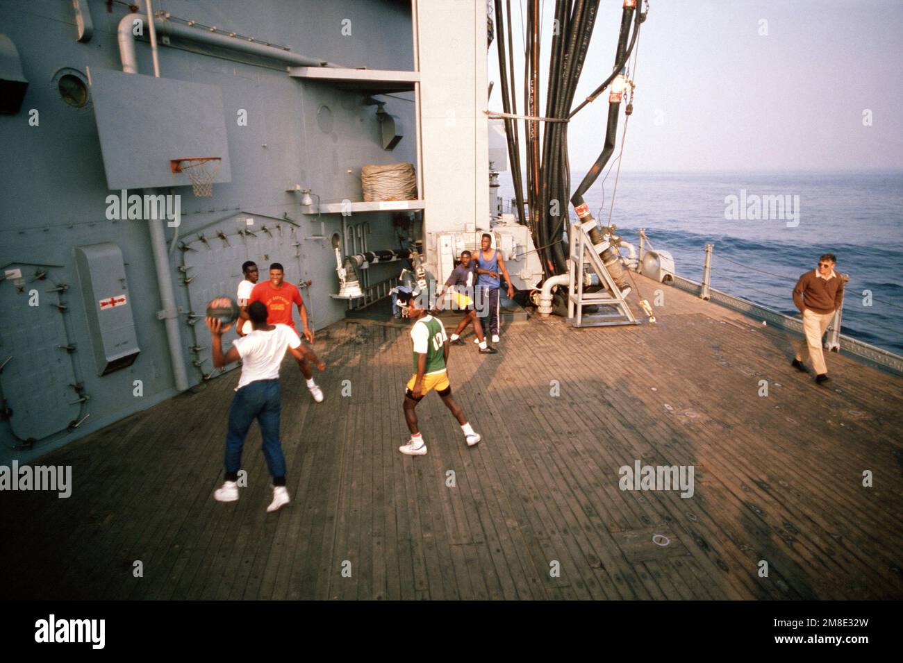 Off-duty sailors play basketball aboard the battleship USS IOWA (BB 61 ...