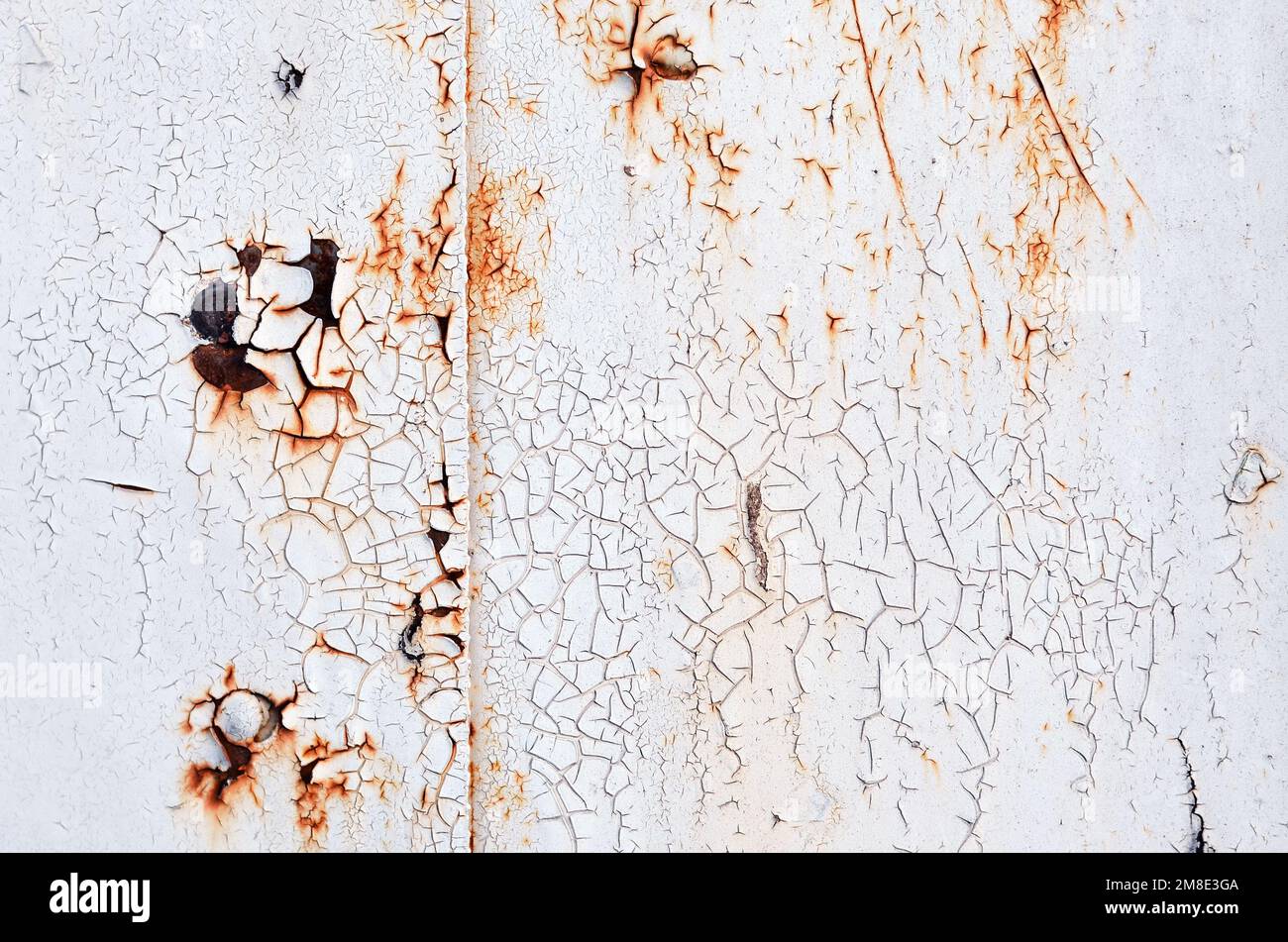 Textured gray surface with cracked old paint and rusty metal as ...