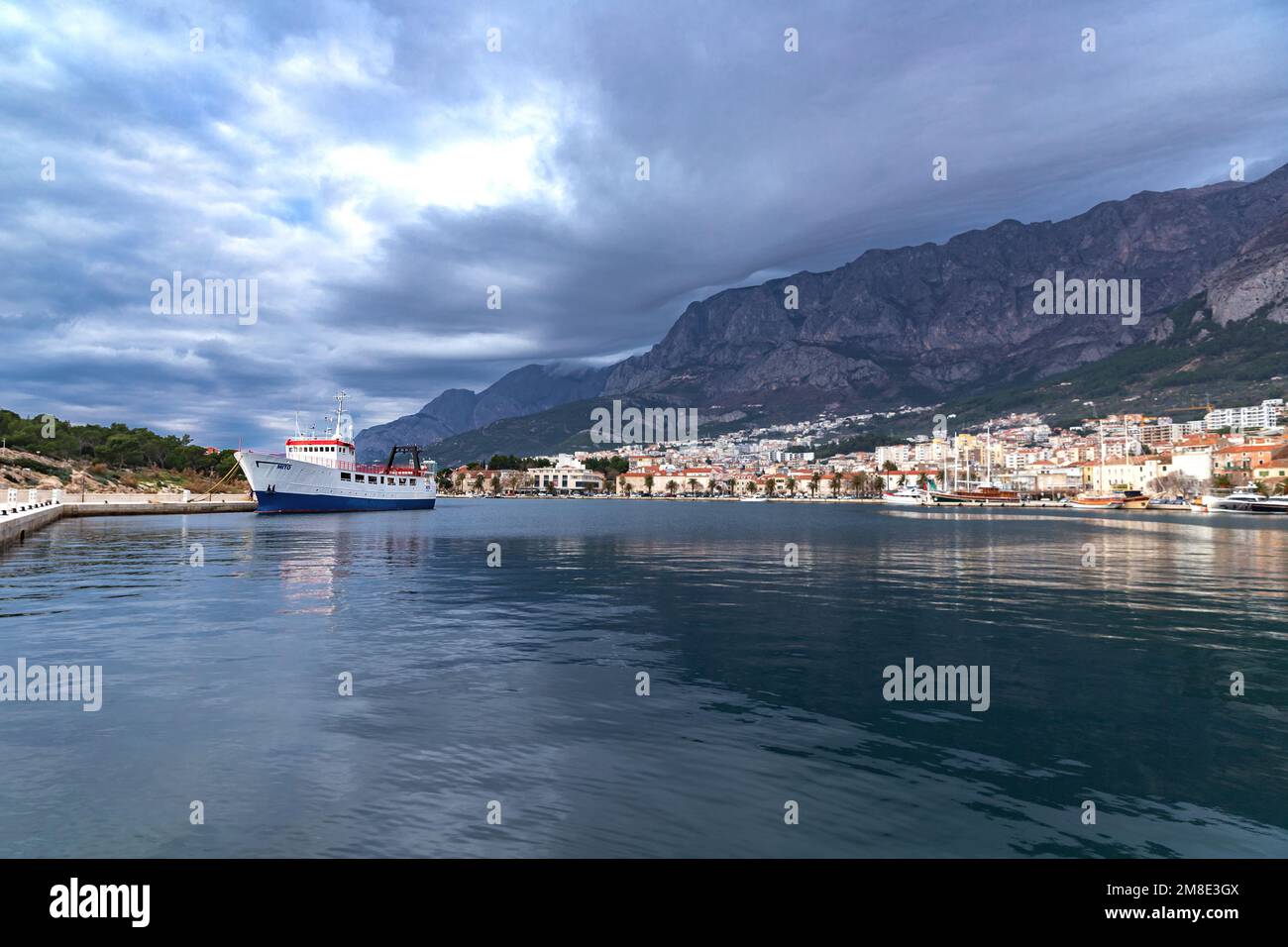 View on the Makarska embankment and ferry MITO Stock Photo - Alamy