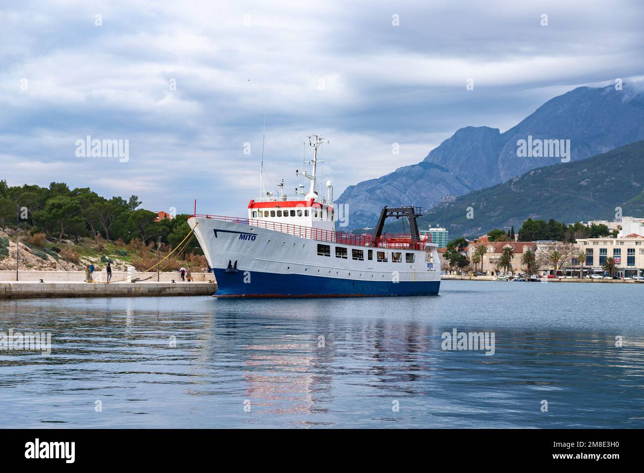 View on the Makarska embankment and ferry MITO Stock Photo - Alamy