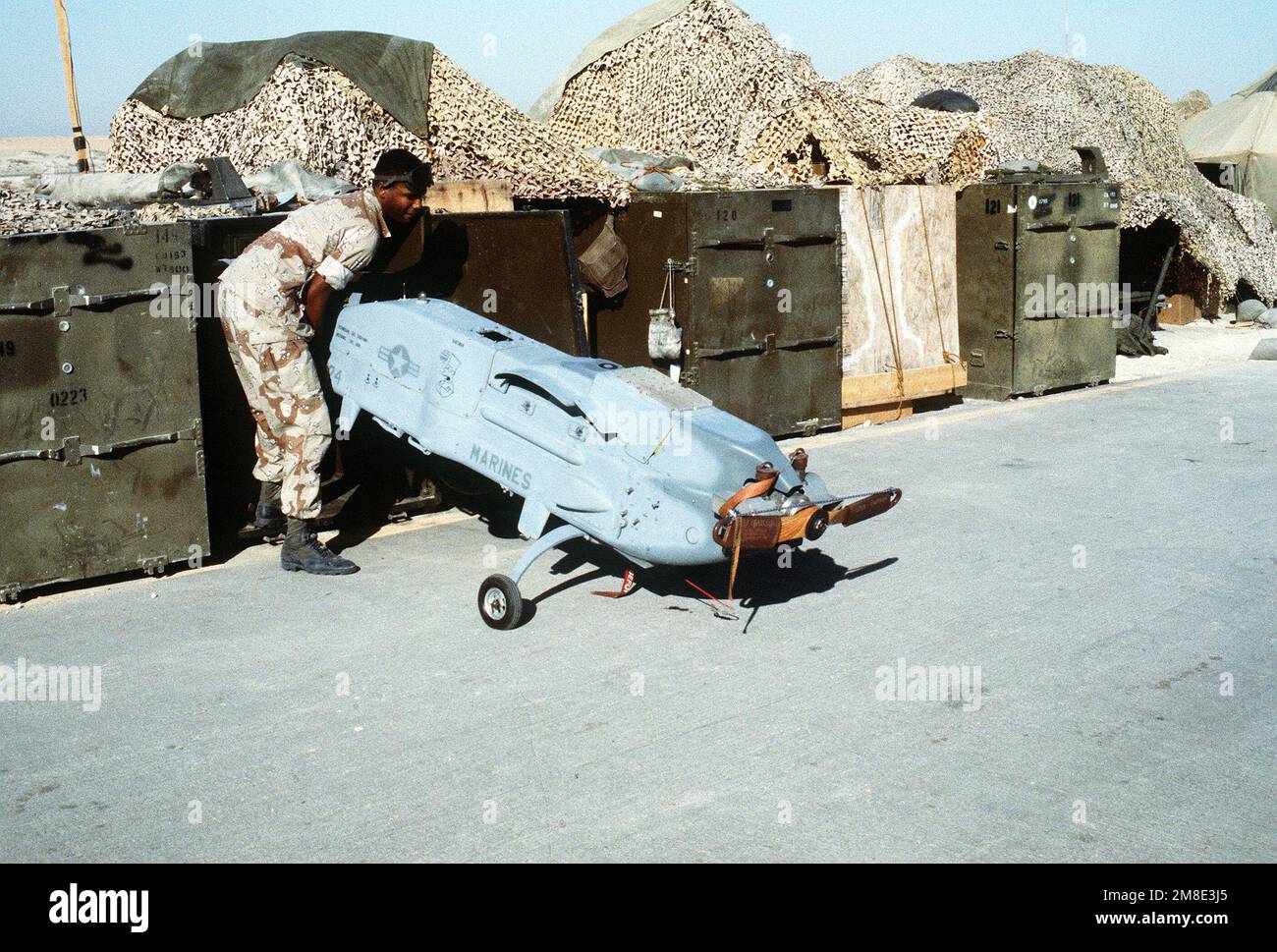 A Marine from the 3rd Remotely Piloted Vehicle (RPV) Platoon wheels the ...