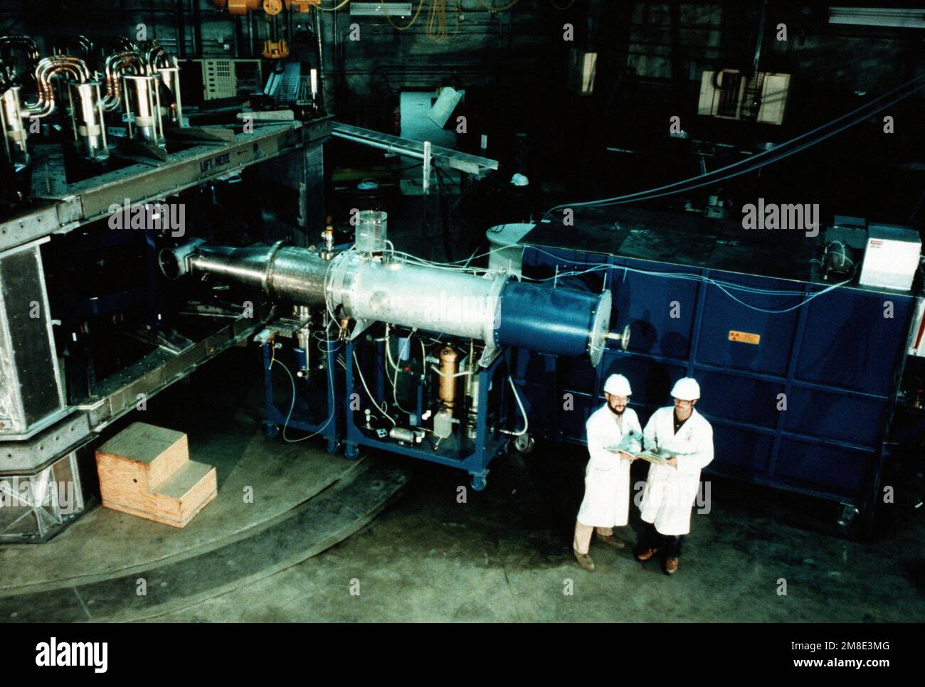 Dr. Jeff Golden, left, and Tom Johnson confer in the modified betatron ...