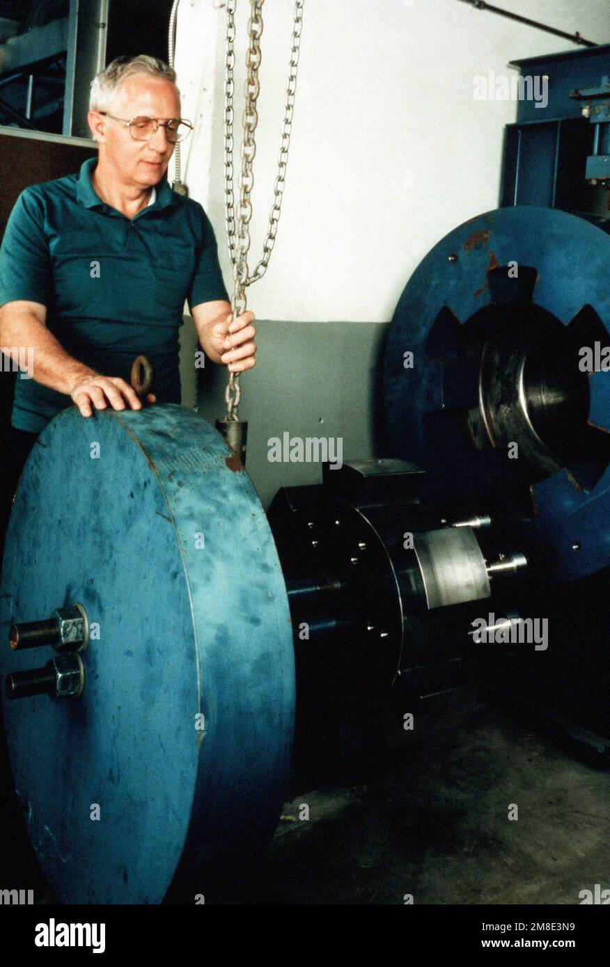 Bill Carson stands beside the end cap of the TR system used to test ...