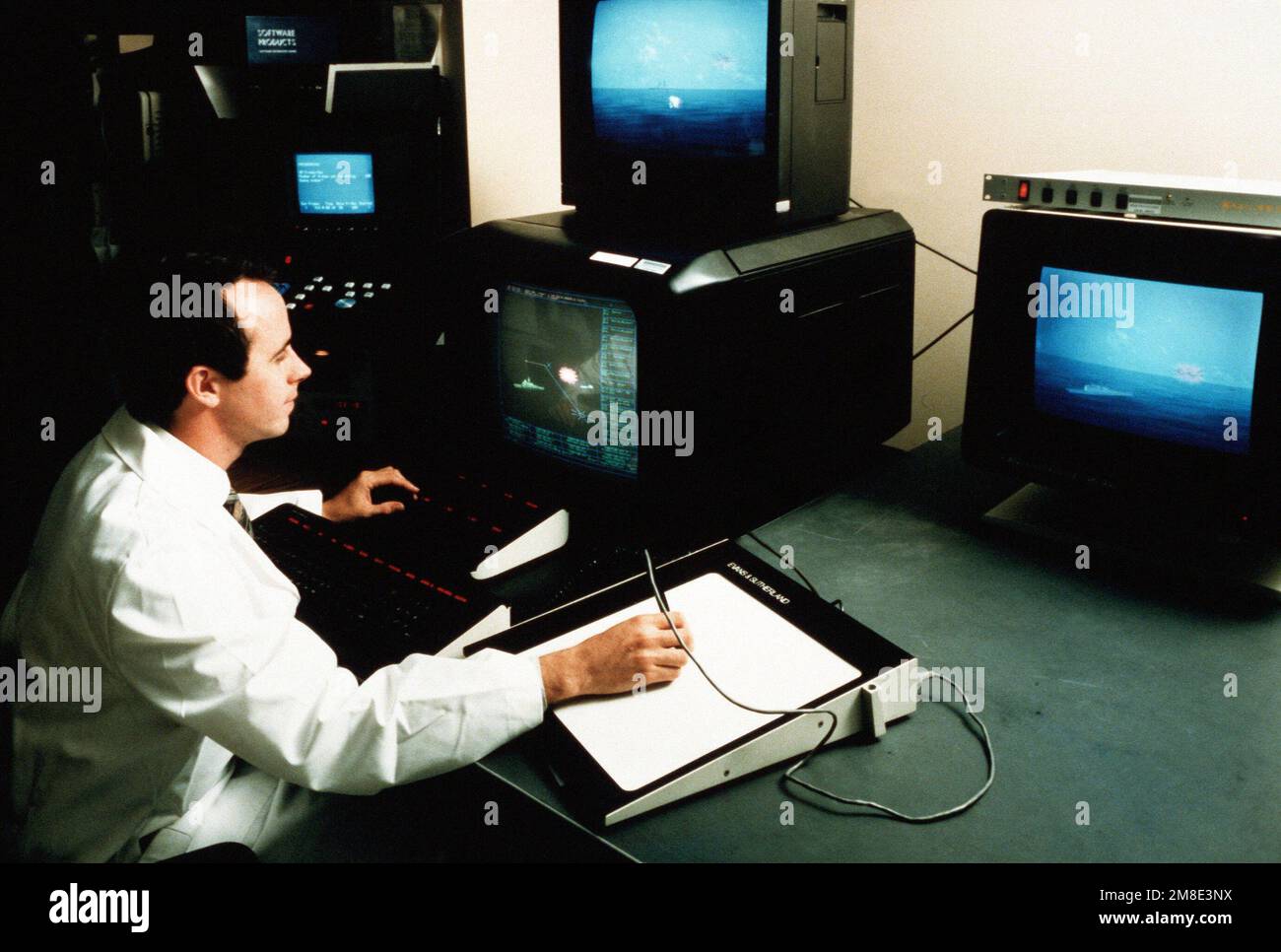 A software technician works on a simulation of an anti-ship missile ...
