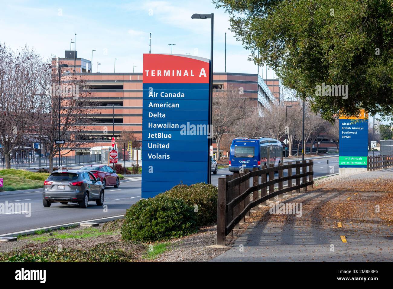 Terminal A road sign with the list of airlines at at San Jose Mineta ...