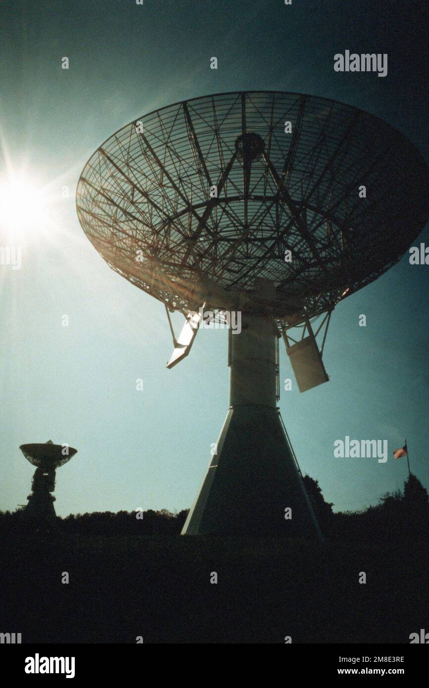 A view of the KENNEDY, foreground, and Aeronica 60-foot parabolic ...