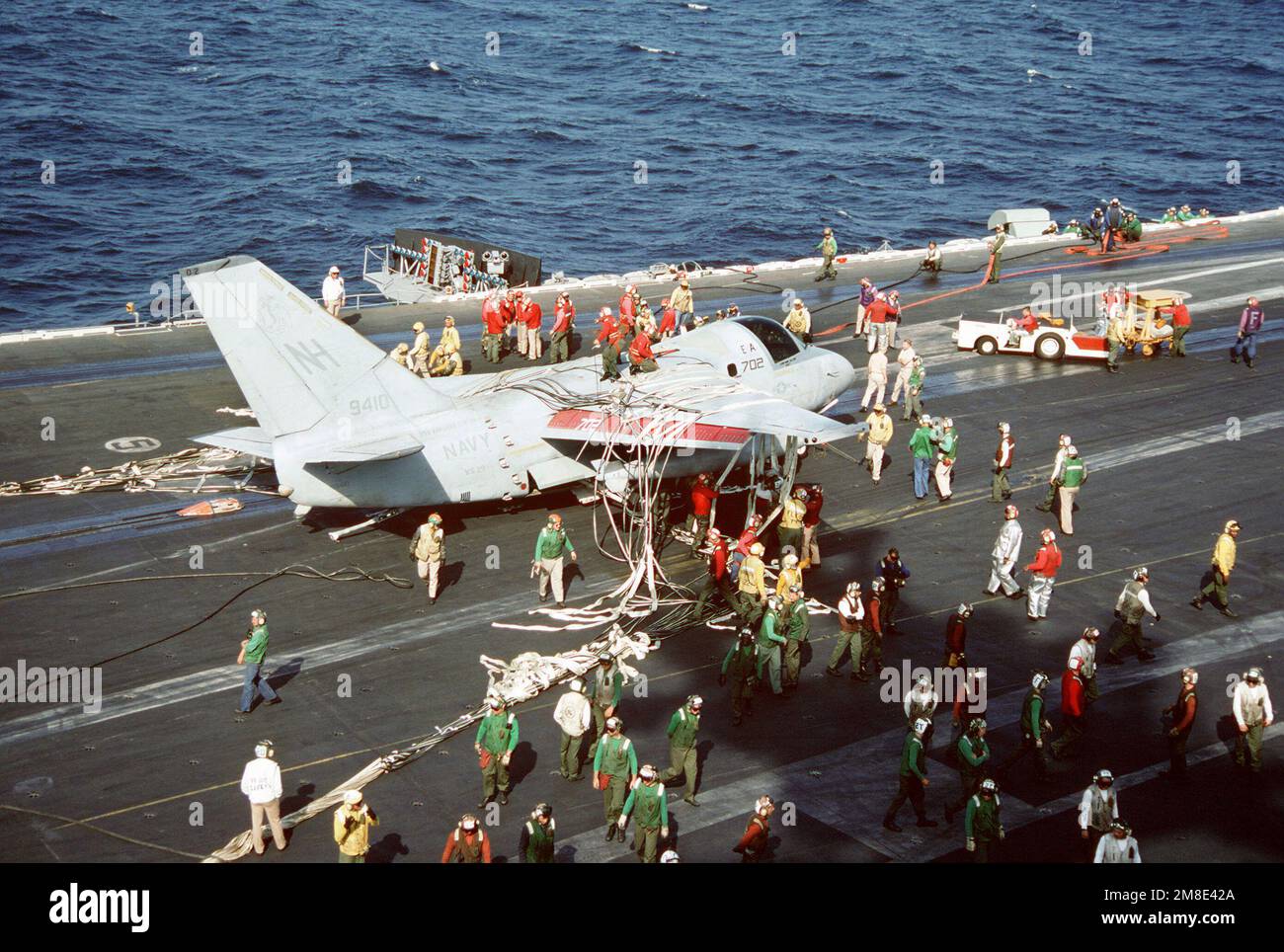 Crewmen aboard the nuclear-powered aircraft carrier USS ABRAHAM LINCOLN ...