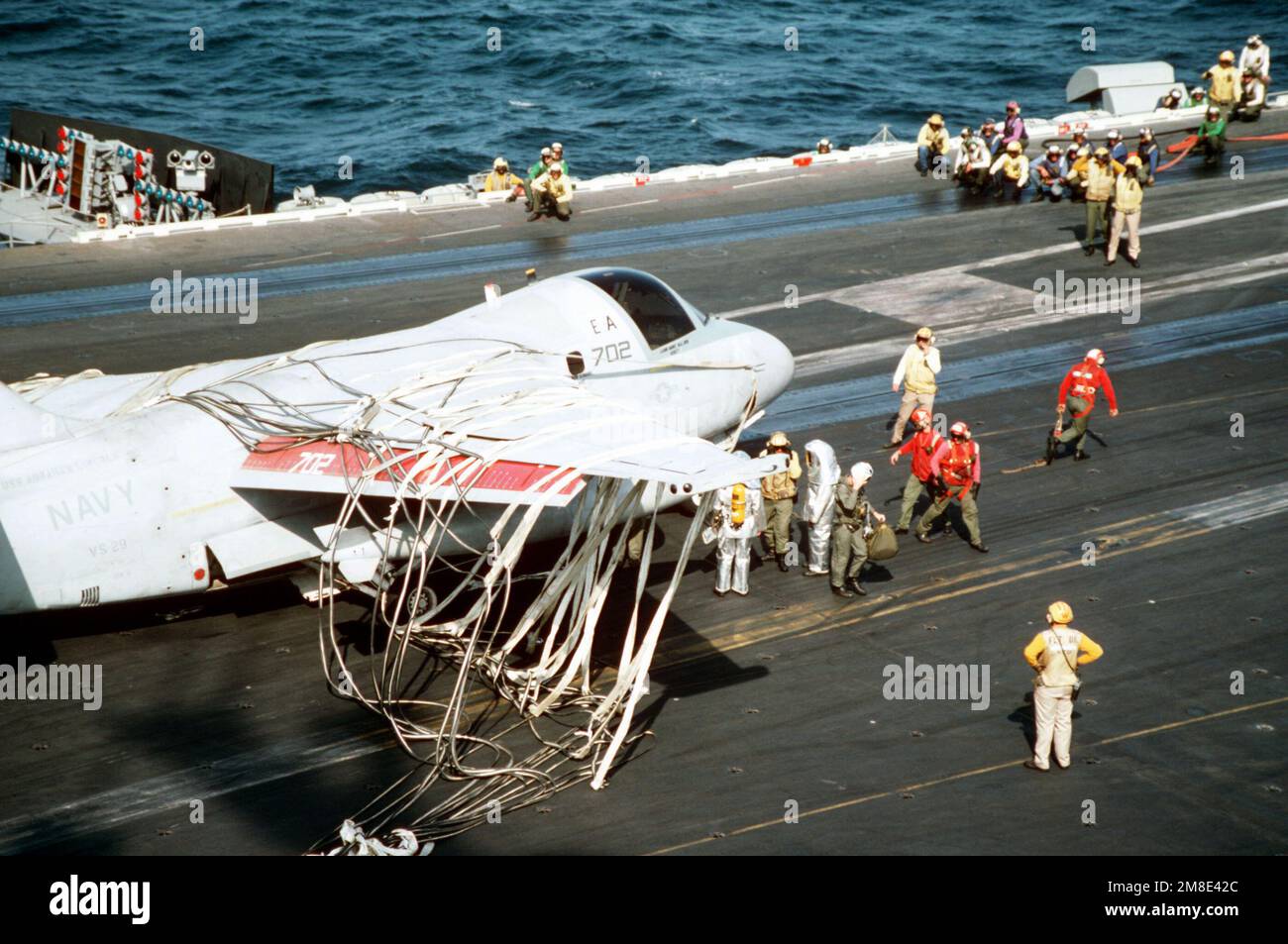 Crash and rescue personnel check over an Air Anti-submarine Squadron 29 ...