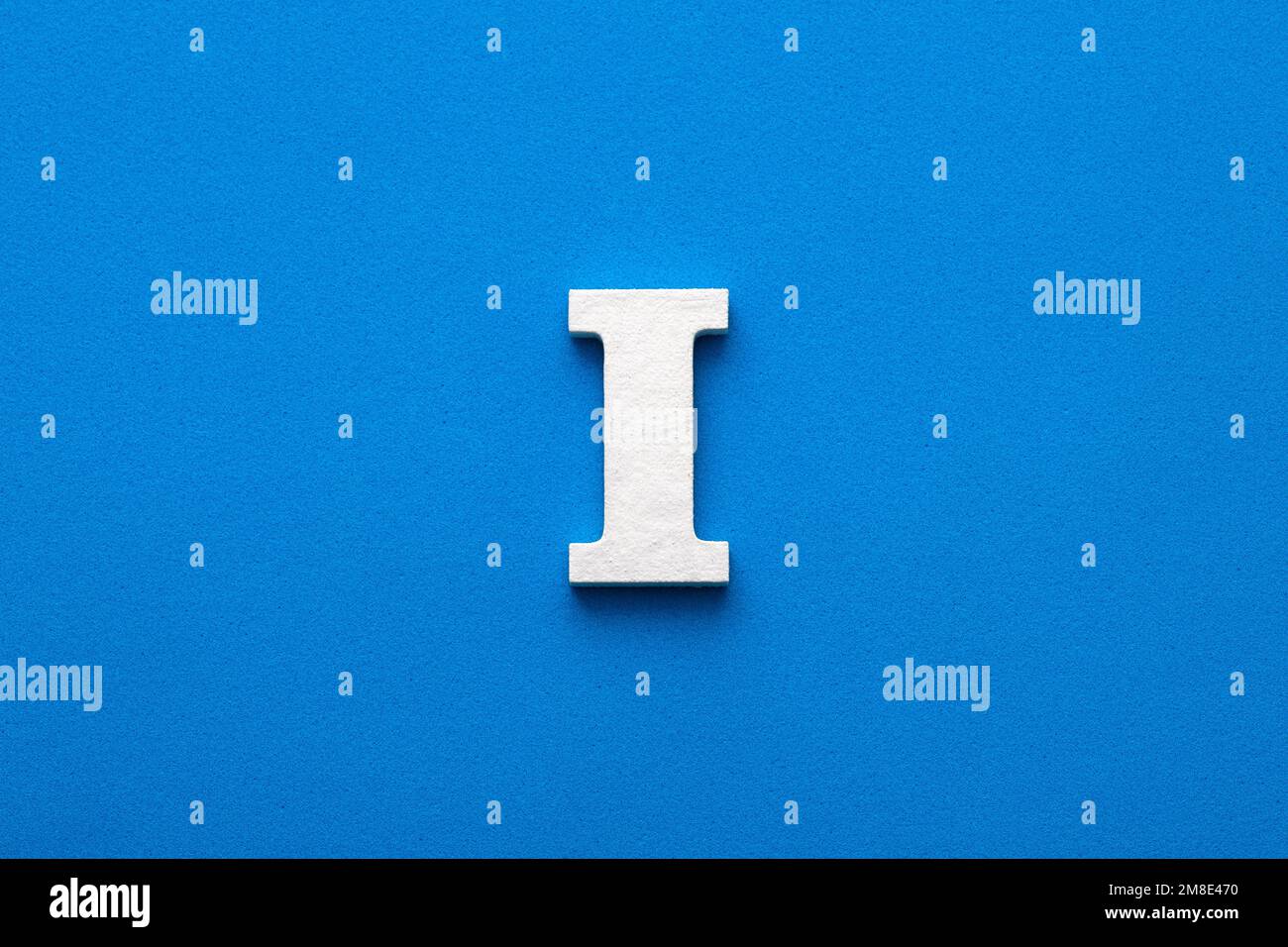 Letter I uppercase - White wood font on blue foamy background Stock ...