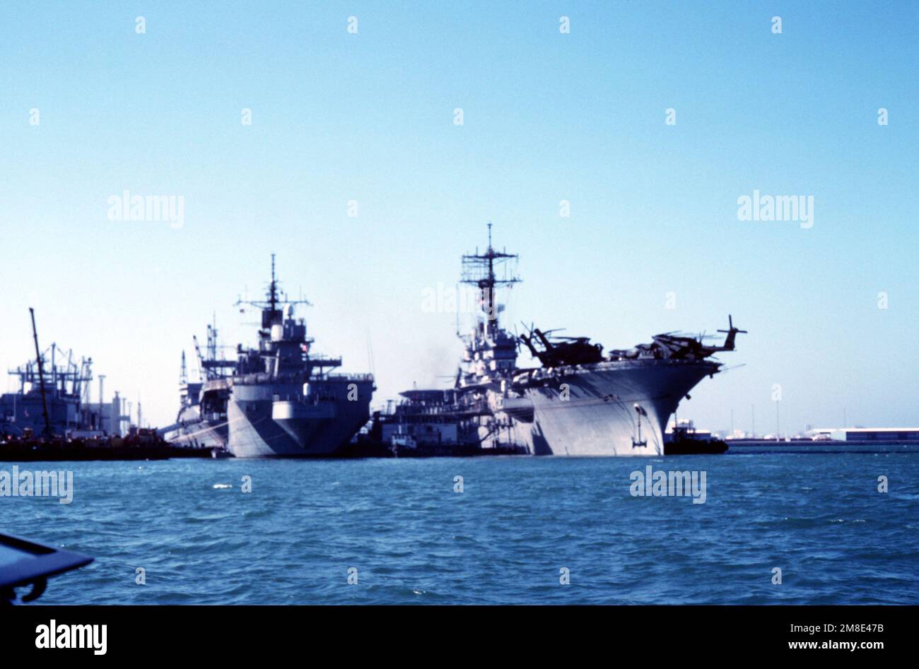 The amphibious command ship USS BLUE RIDGE (LCC 19), and the amphibious ...