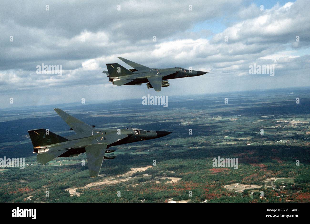 An air-to-air right side view of two FB-111A aircraft of the 509th ...