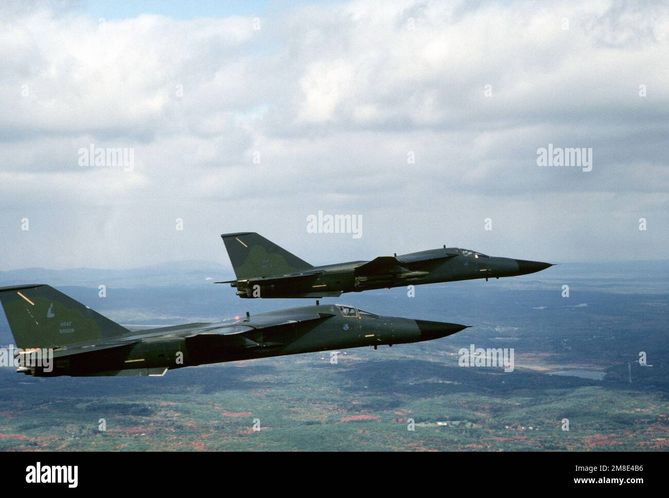 An air-to-air right side view of two 509th Bombardment Wing FB-111A ...