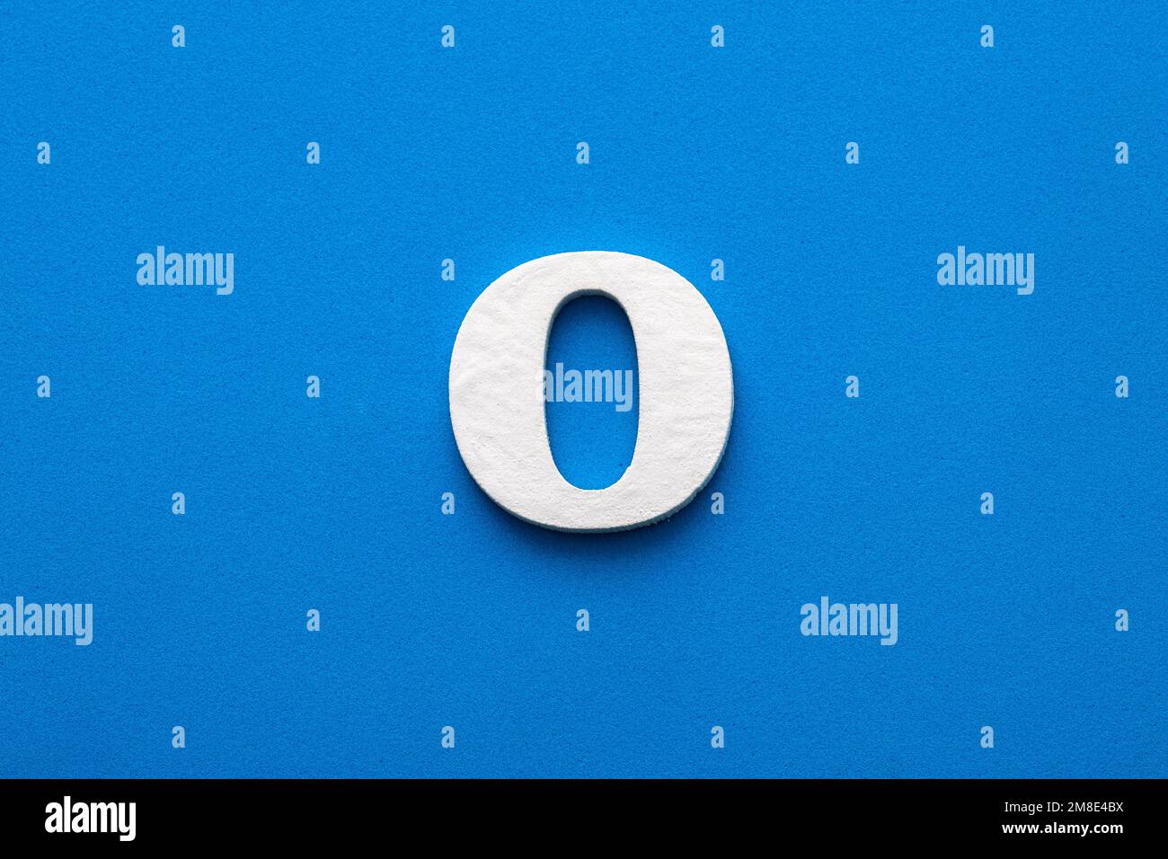 Letter O uppercase - White wood font on blue foamy background Stock ...