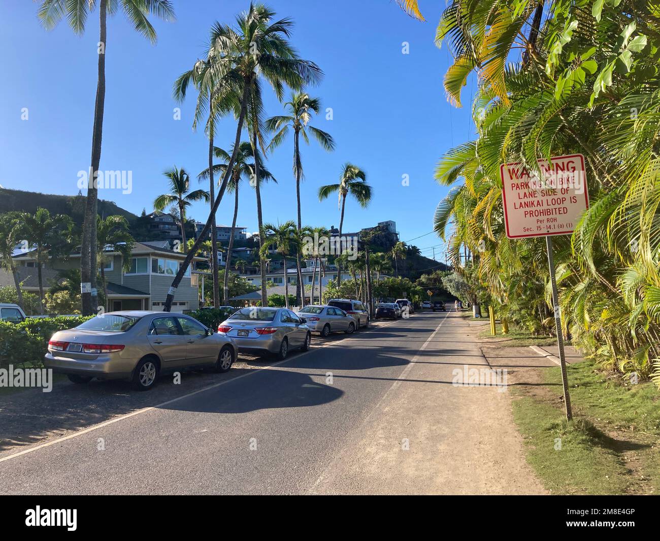Cars of Lanikai Beach visitors parked bumper to bumper along Mokulua ...