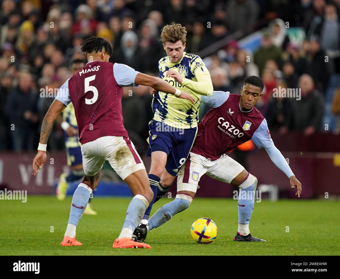 Aston Villa's Ezri Konsa (right) and Tyrone Mings take on Leeds United ...