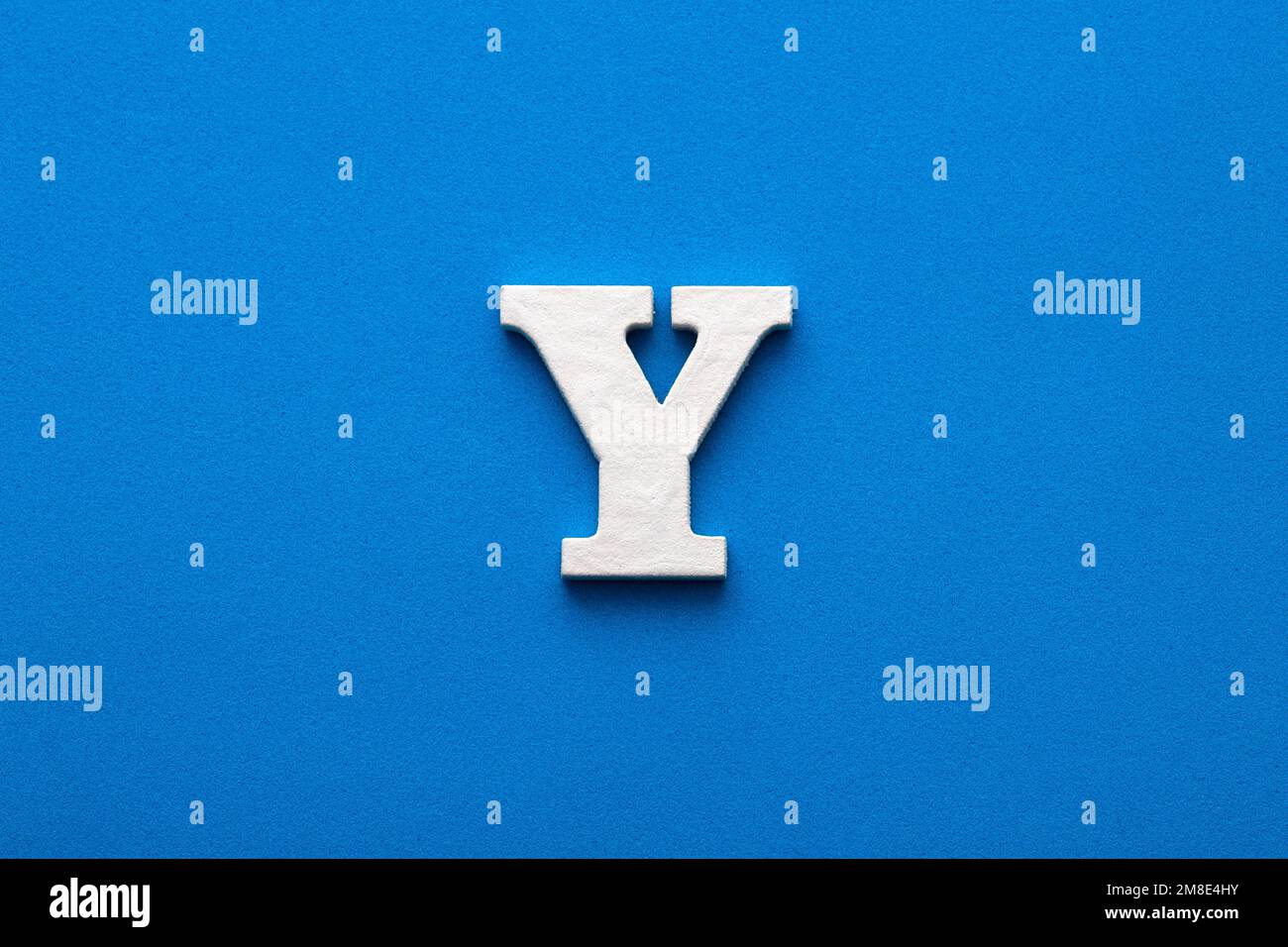 Letter Y uppercase - White wood font on blue foamy background Stock ...