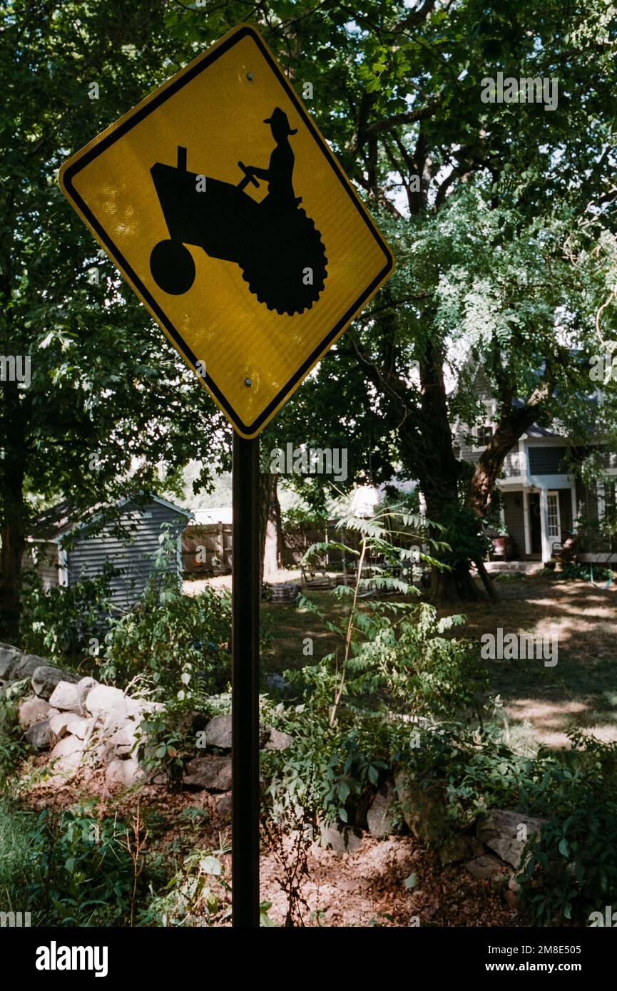A yellow Tractor Crossing sign hangs before the entrance to the Codman ...