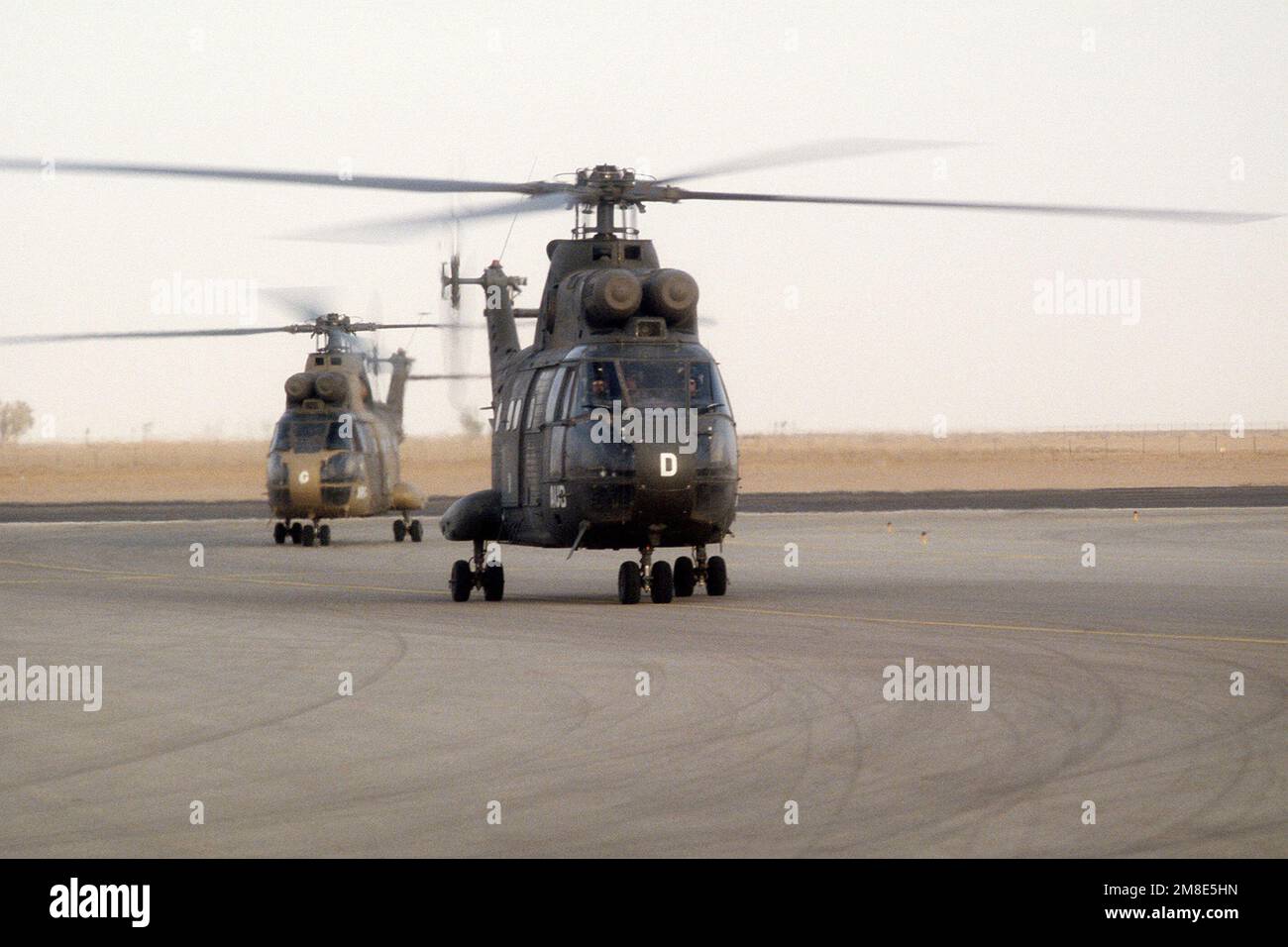 SA.330 Puma helicopters of the French army taxi on an airfield after ...