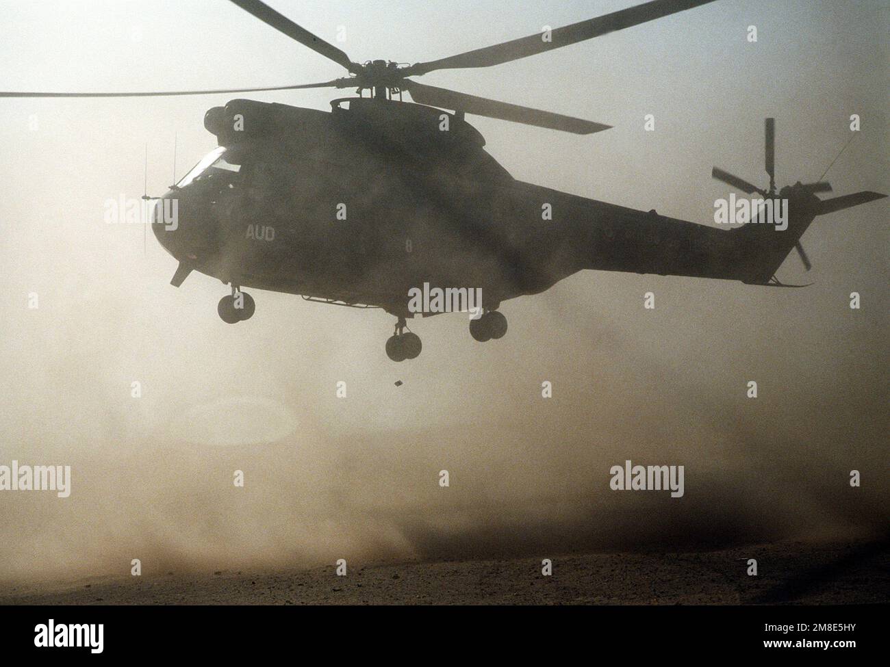 An SA.330 Puma helicopter of the French army lifts off in a cloud of ...