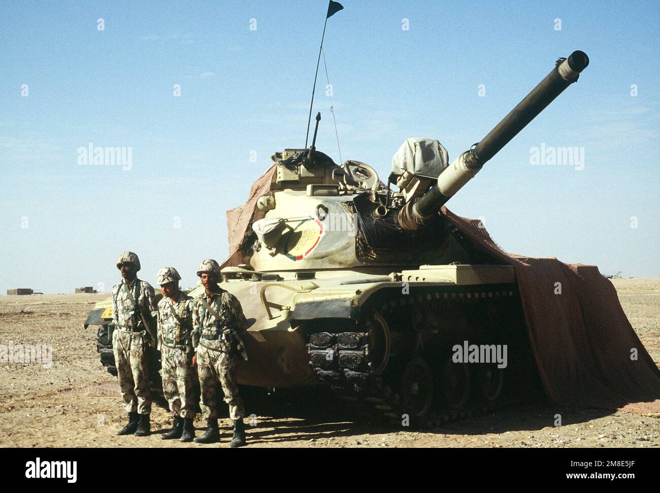 Egyptian soldiers stand in front of a 3rd Armored Brigade M-60 main ...